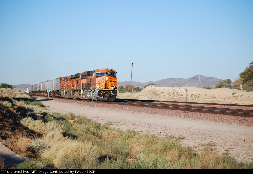 BNSF 7917 starts into the curve as she slows for BNSF Barstow yard, CA.
